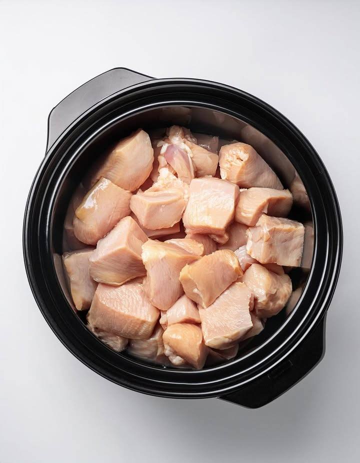 Put raw cubed chicken in a slow cooker with these 4 ingredients. You’ll ...